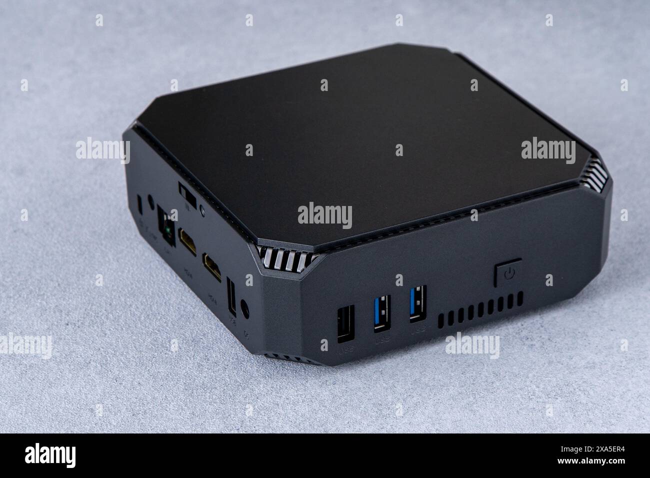 A small system unit of a personal computer. Compact black device Stock ...