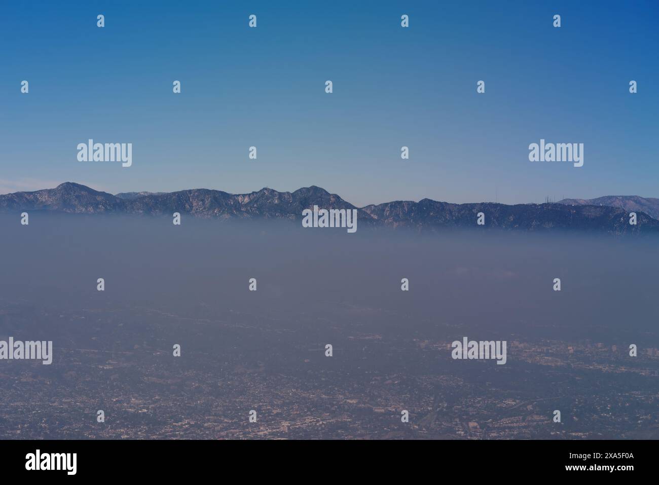 Aerial view, looking north, showing a heavy layer of smog over the ...