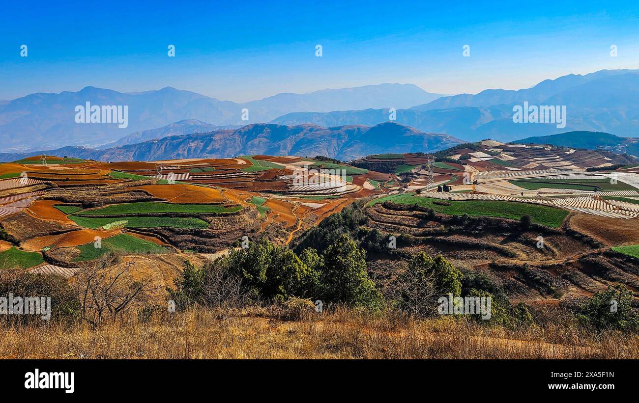 A scenic view of the colorful Qicai Slope in Yunnan, China Stock Photo ...