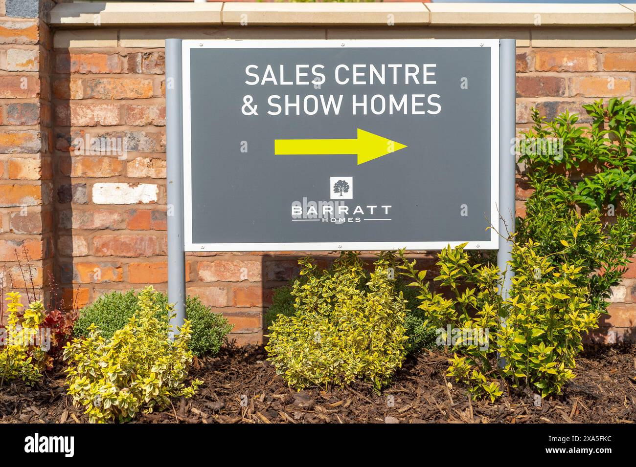 Barratt Homes Sales Centre & Show Homes sign on the side of a wall on a ...