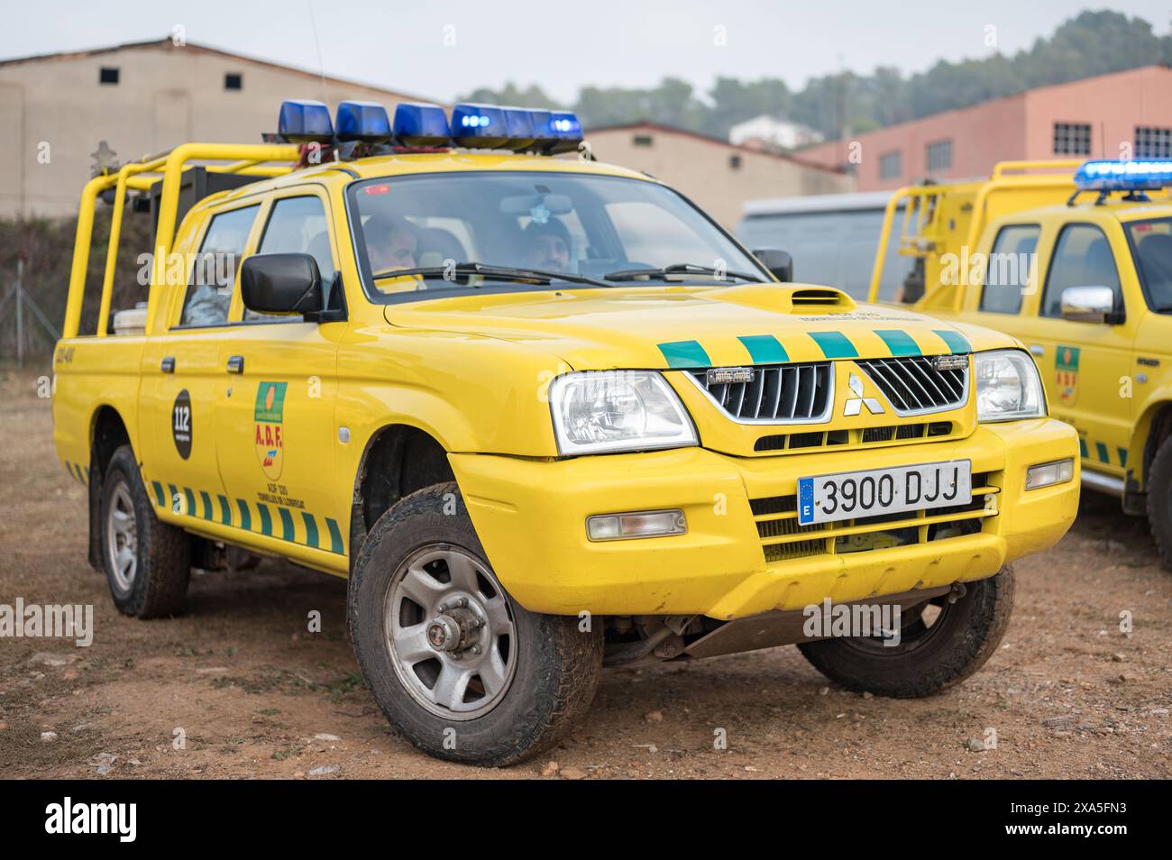 A yellow Mitsubishi L200 pickup truck with sirens from the town's ...