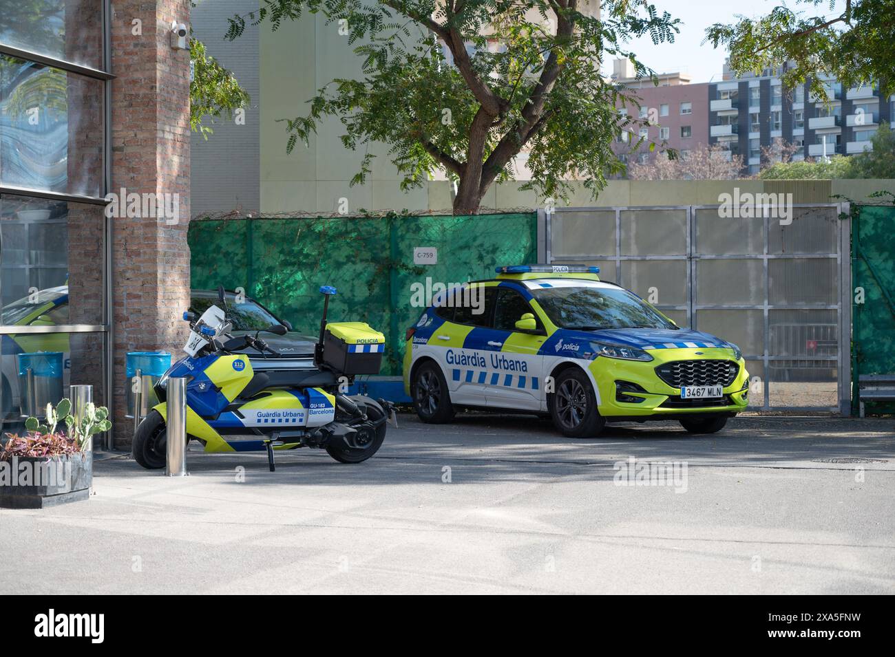 The Barcelona Urban Police police vehicles parked at the base of the ...