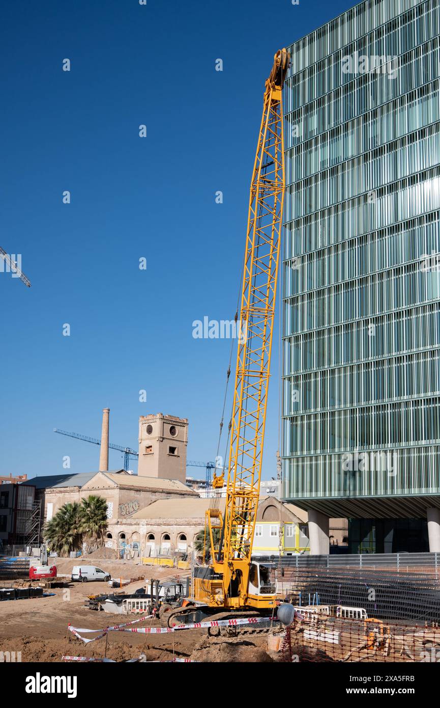 The cranes in the construction works of new buildings in the city of ...