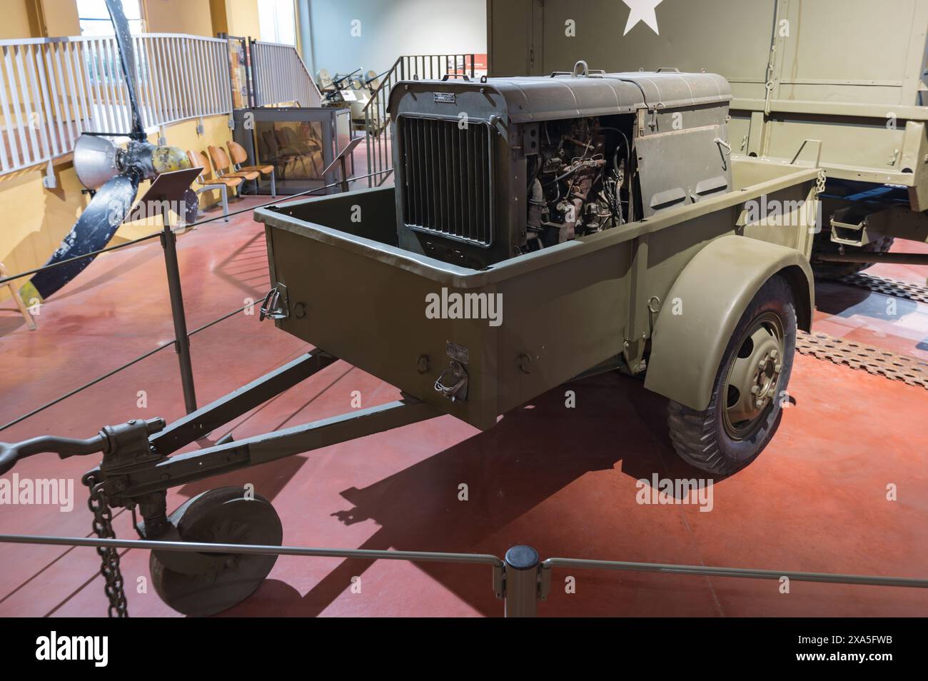 An old military trailer with a generator set to generate electricity on ...