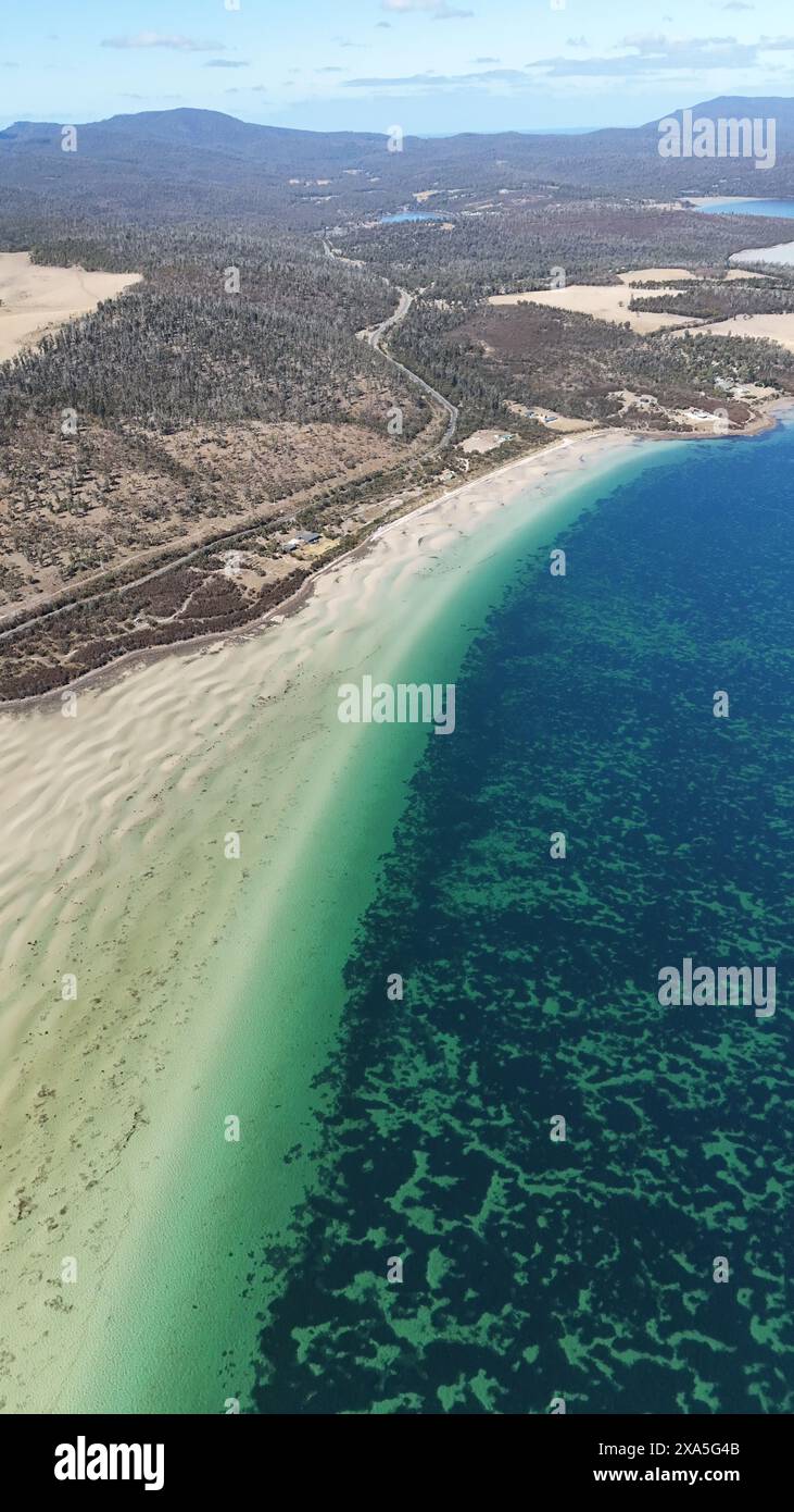A picturesque beach landscape with a sandy coastline and clear water in ...