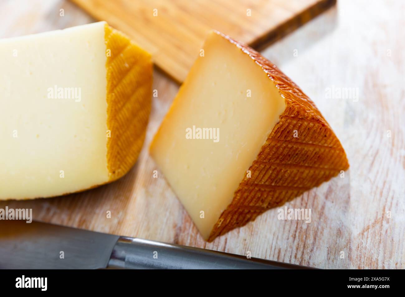 Sector of Spanish cheese on wood surface Stock Photo - Alamy