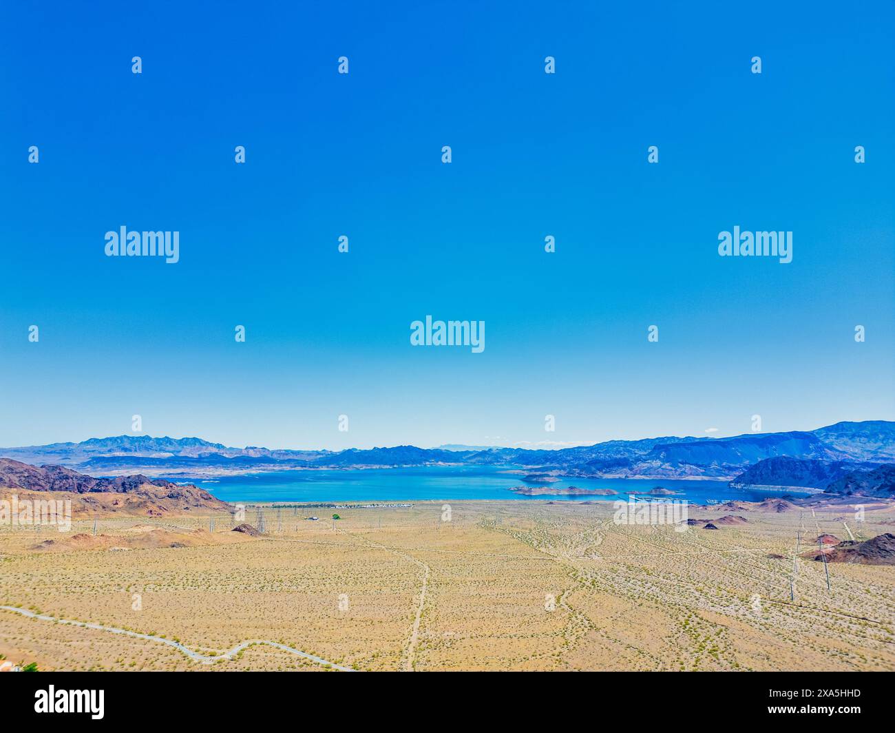 A stunning panoramic view of Lake Mead against a vast desert backdrop ...