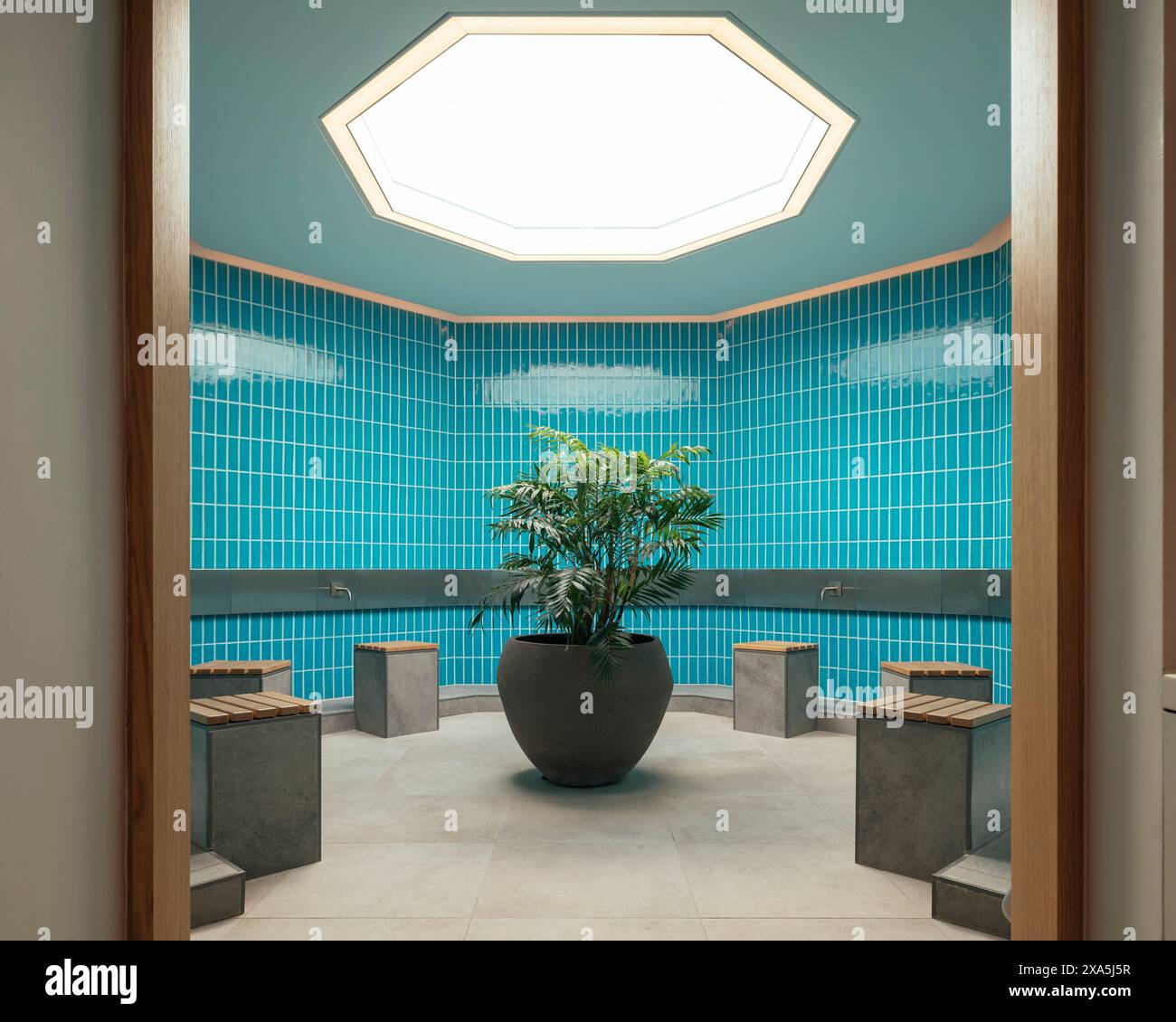 A Hexagonal chamber for washing before prayer, with blue tiles and ...