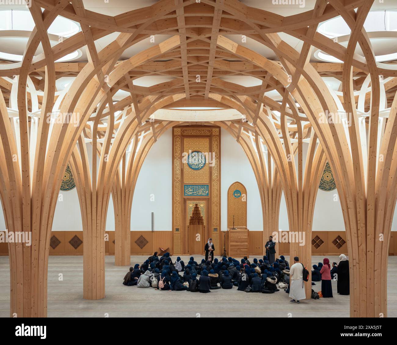 Distant view showing large capacity prayer room with a forest of ...