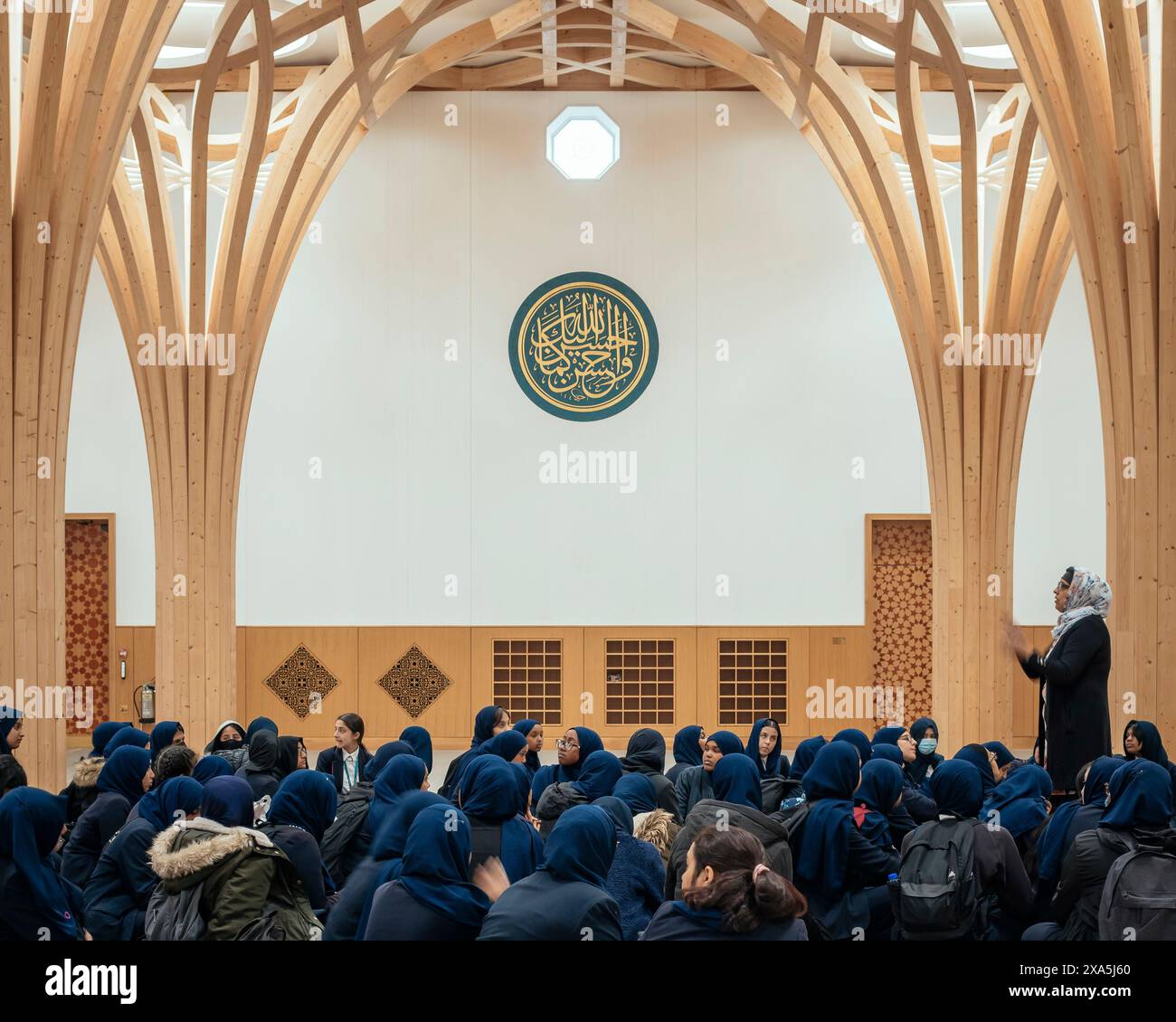 Distant view showing large capacity prayer room with intricate timber ...