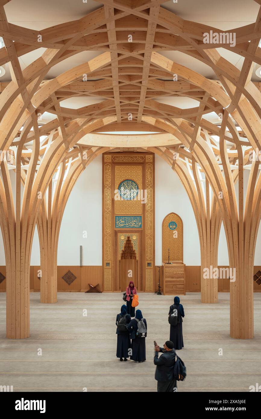 Distant view showing large capacity prayer room with a forest of ...