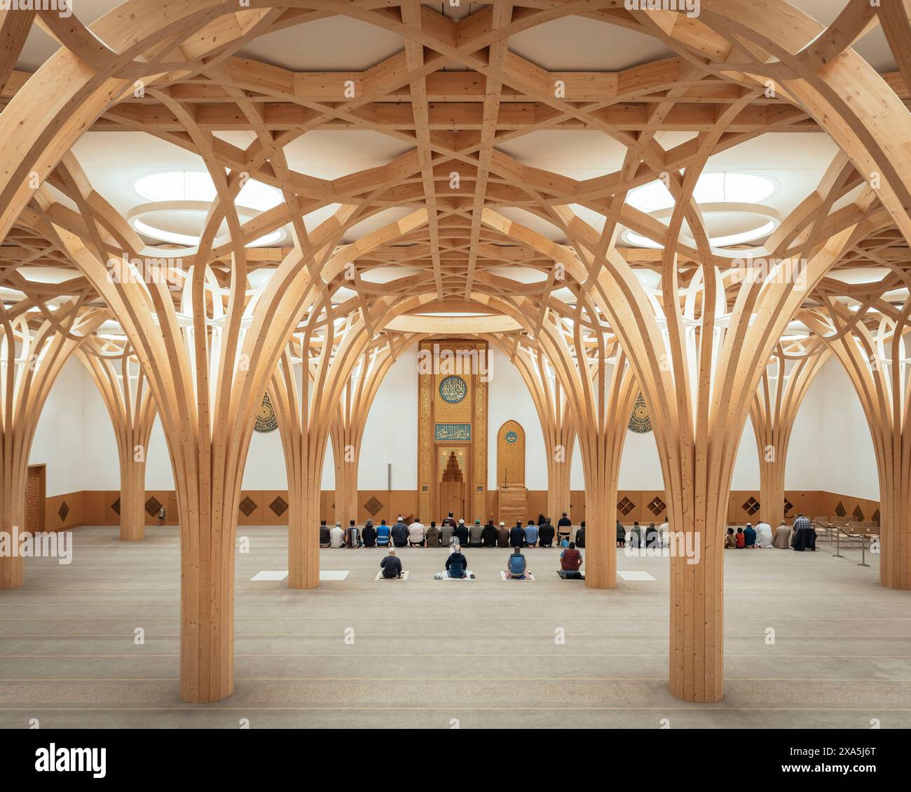 Distant view showing large capacity prayer room with a forest of ...