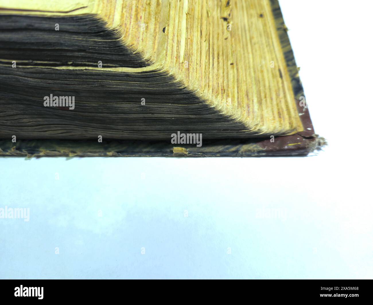 An opened old book with exposed pages put on the table Stock Photo - Alamy