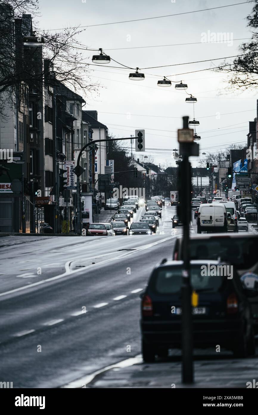 An urban street with cars driving on each side Stock Photo - Alamy