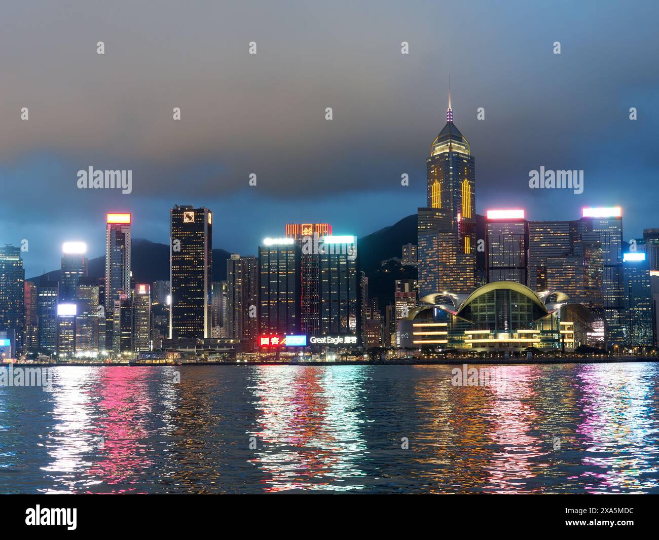 A view of the Hong Kong Victoria harbour skyline at night with the tall ...