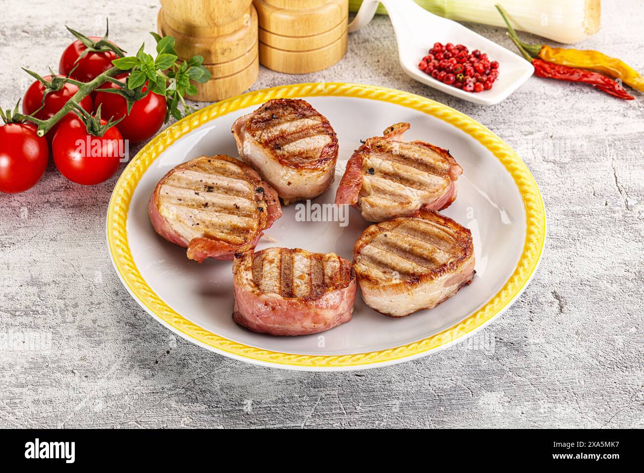 Grilled pork tenderloin medallion with bacon Stock Photo - Alamy