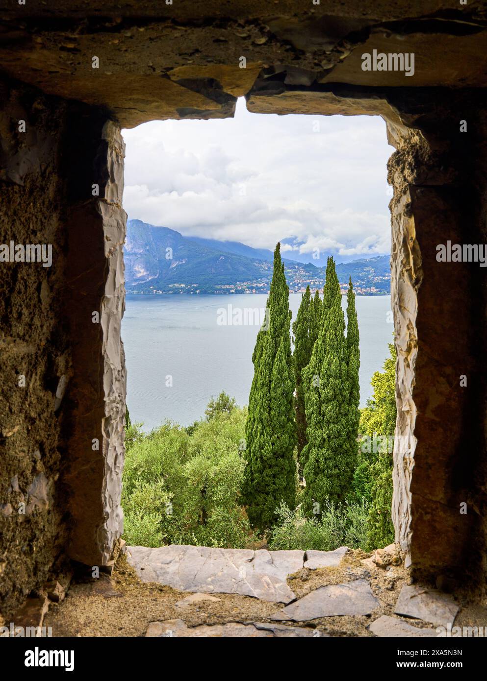 Open stone building window with water and hills in the background Stock ...