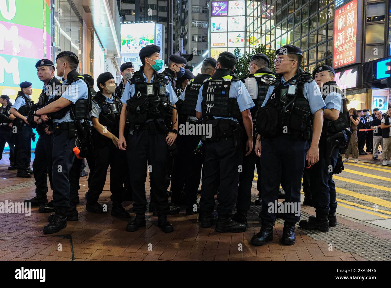 Hong Kong, China. 4th June, 2024. Police officers stand guard at ...