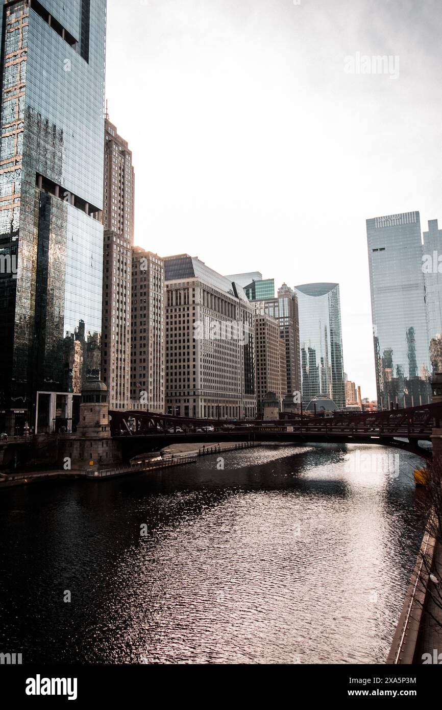 An urban waterway surrounded by tall buildings and skyscrapers Stock ...