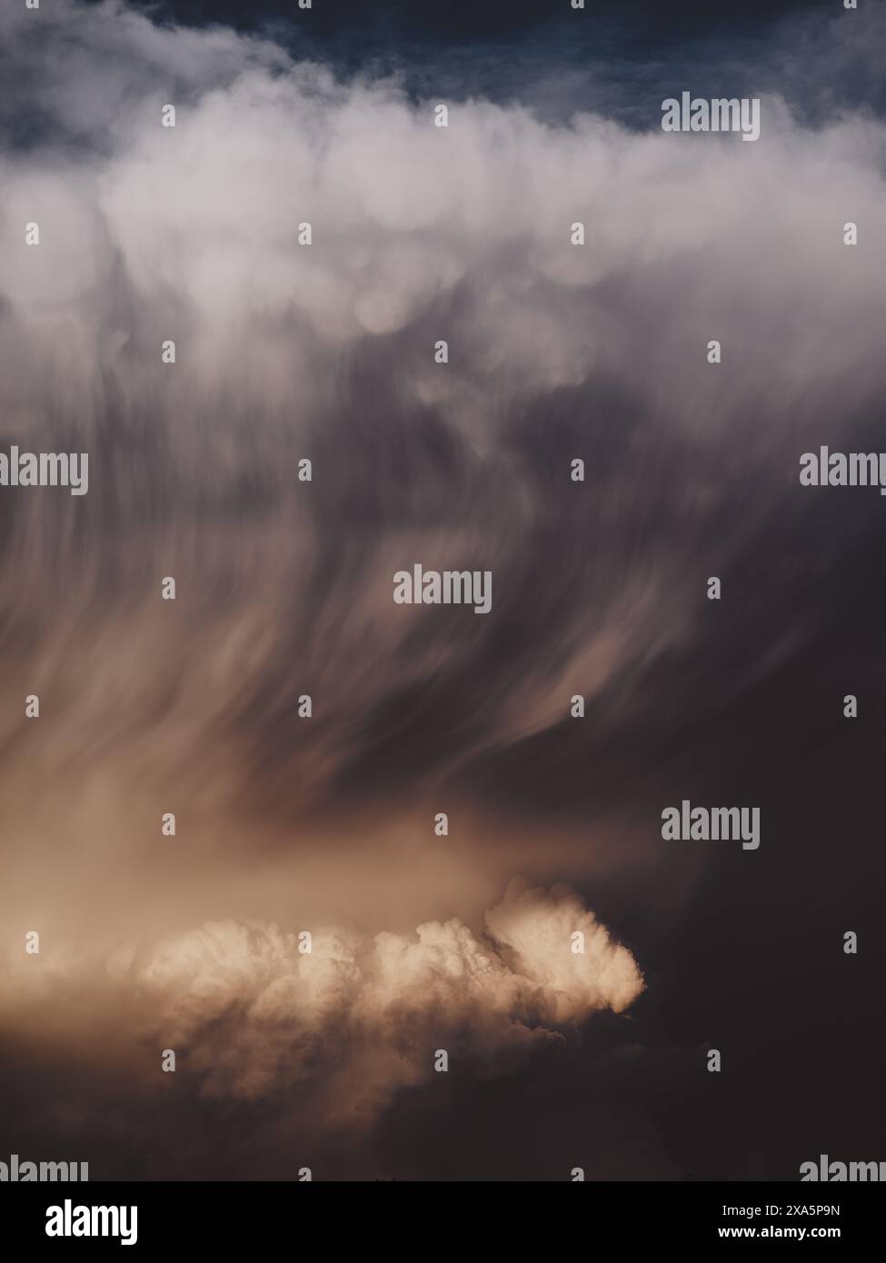 A wispy cloud stretches high at sunset Stock Photo - Alamy