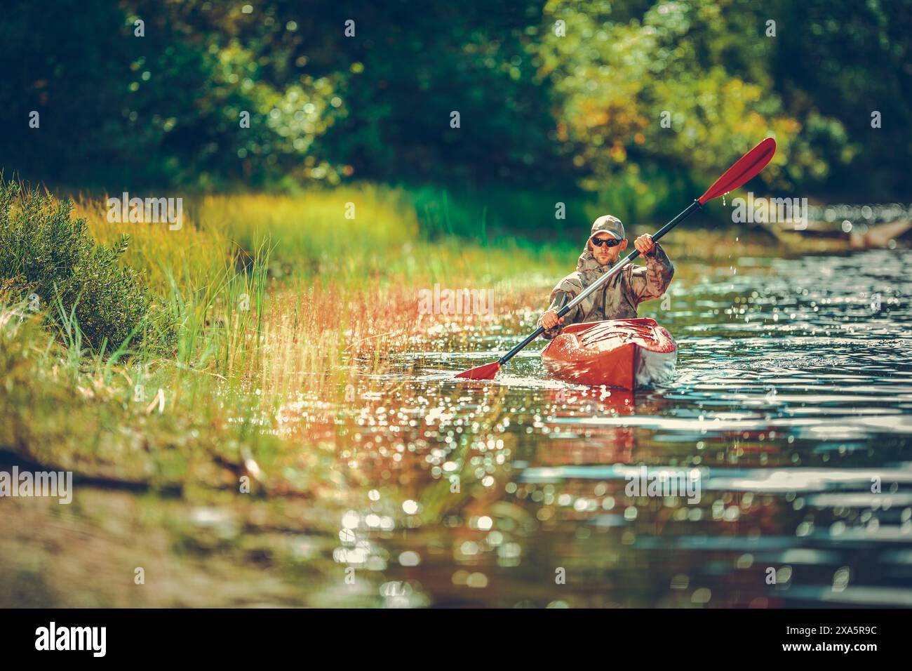 A Caucasian Men kayaking in the river Stock Photo - Alamy