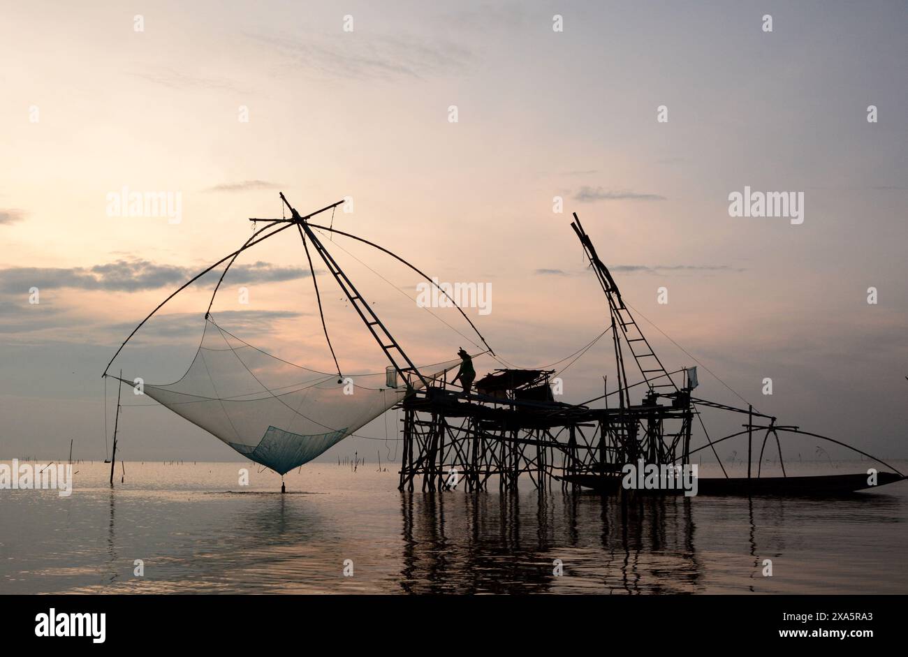 Fishing net silhouette at sunrise. Thale Luang. Phatthalung. Thailand ...