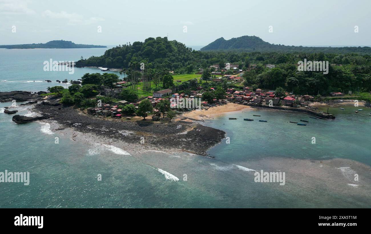 A village on a small island with numerous beachfront buildings in the ...
