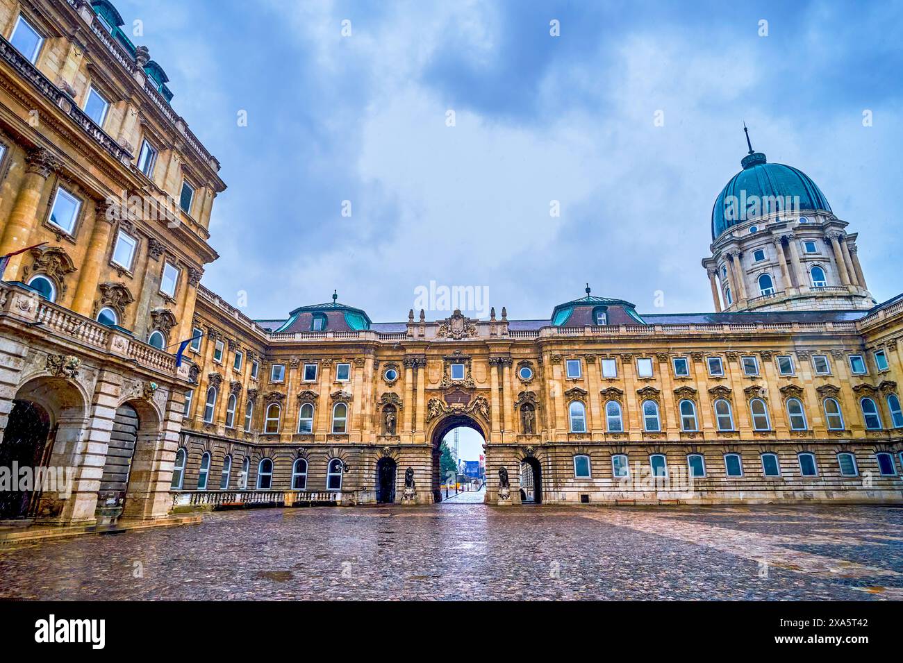 The Lion Court with the entrance Arch Gate and the dome of Buda Castle ...