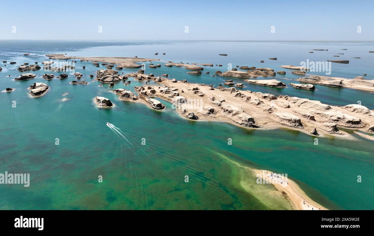 An aerial photo is showing the landscape of Usut (over water) Yadan ...