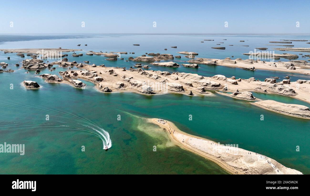 An aerial photo is showing the landscape of Usut (over water) Yadan ...