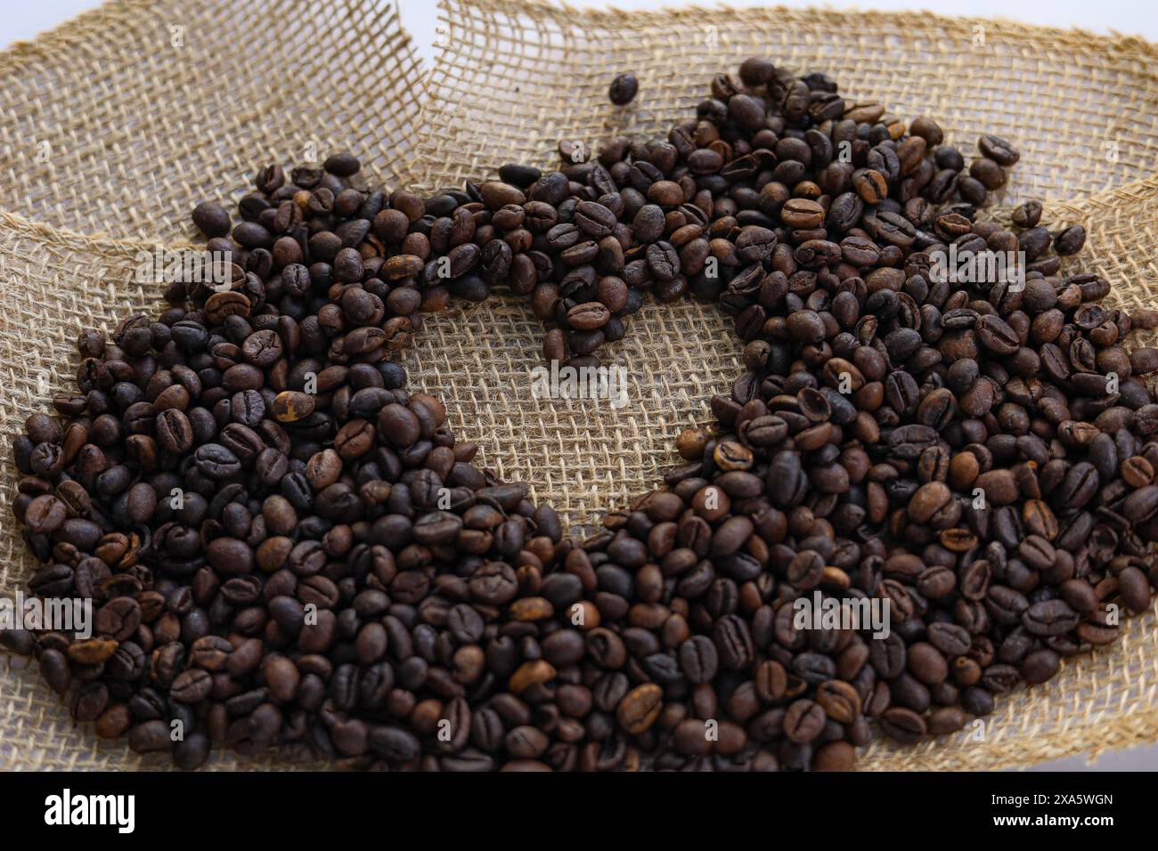 Many coffee beans arranged on a table surface Stock Photo - Alamy