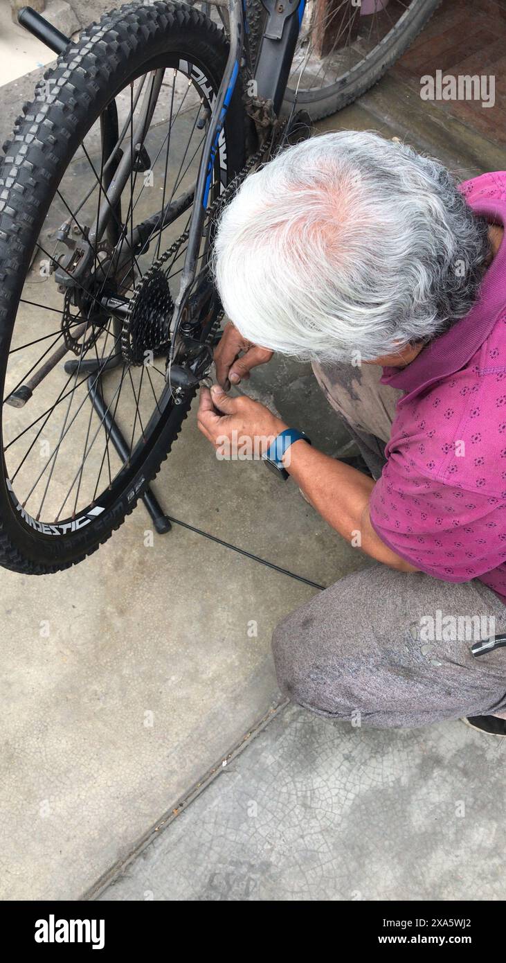 Senior lady on bike hi-res stock photography and images - Alamy