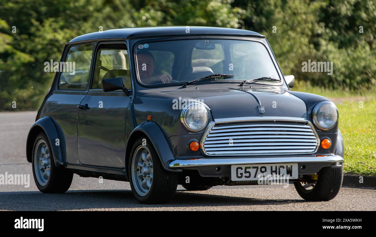 Stony Stratford,UK - June 2nd 2024: 1989 grey Rover Mini car driving on ...