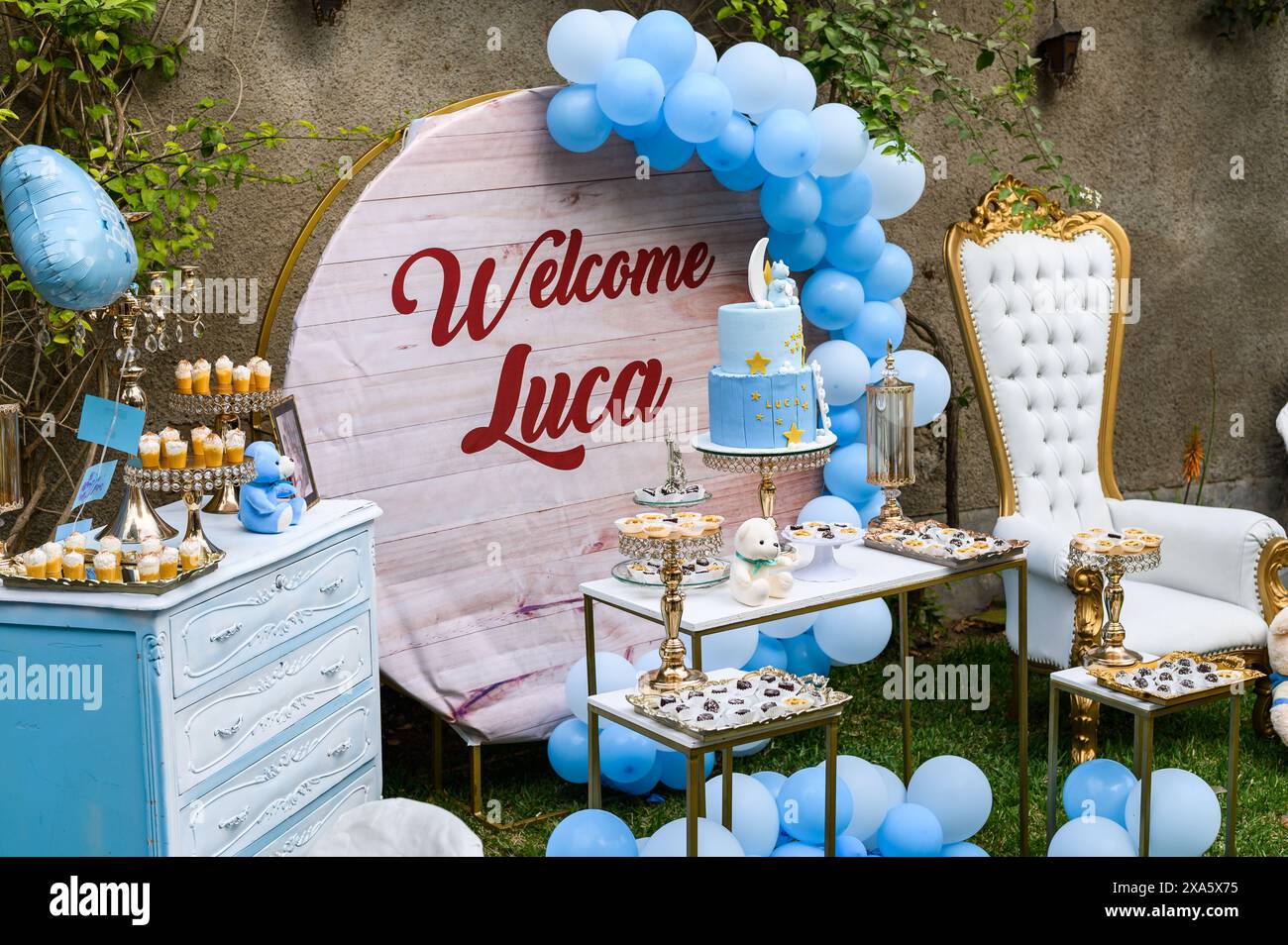 Elegant baby shower setup for a boy named luca, with cake, balloons ...