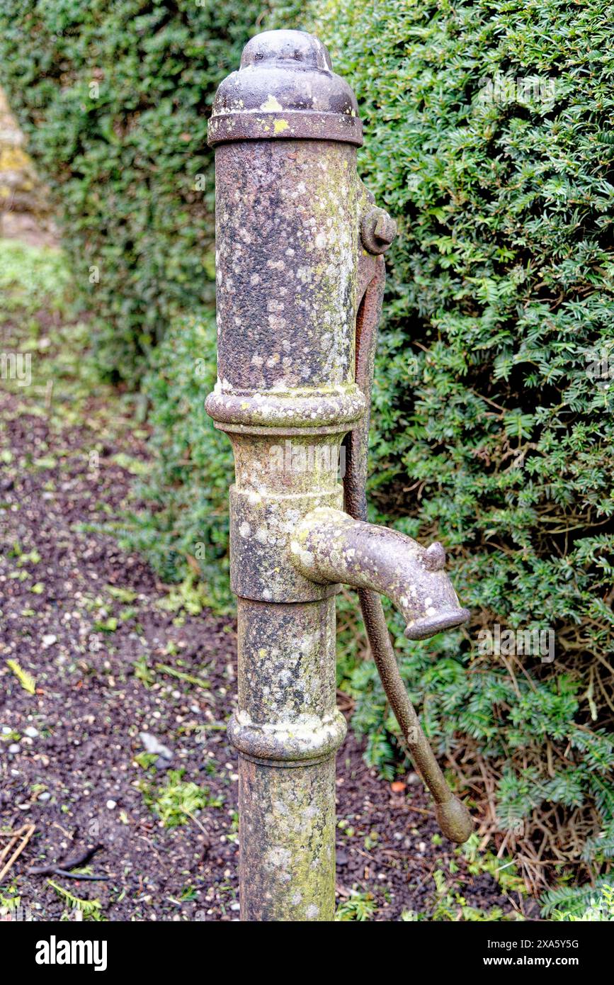 Well hand pump in the garden - Vintage - old cast iron water pump Stock ...