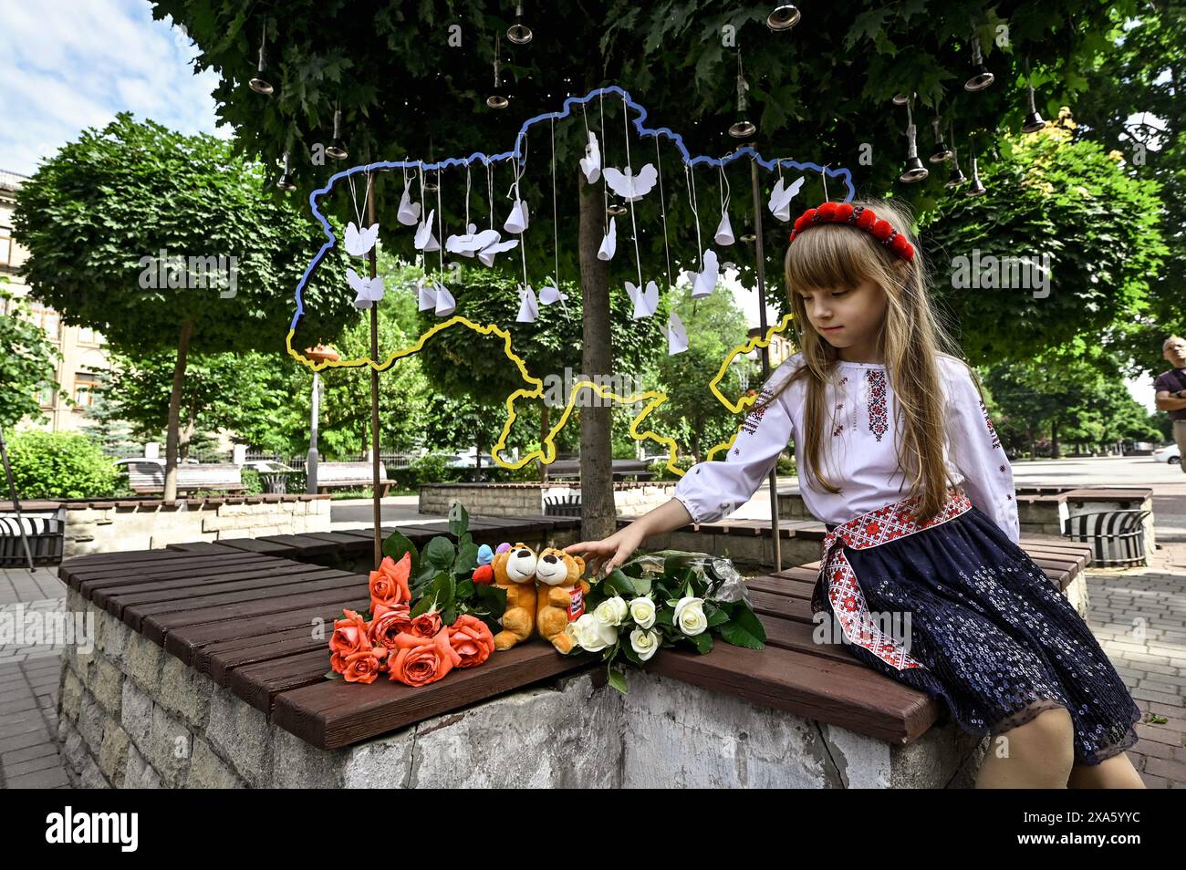 ZAPORIZHZHIA, UKRAINE - JUNE 04, 2024 - A girl touches a toy at the ...