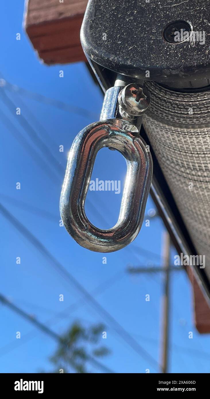 A close-up of patio shade metal loop to be able to turn with a long ...
