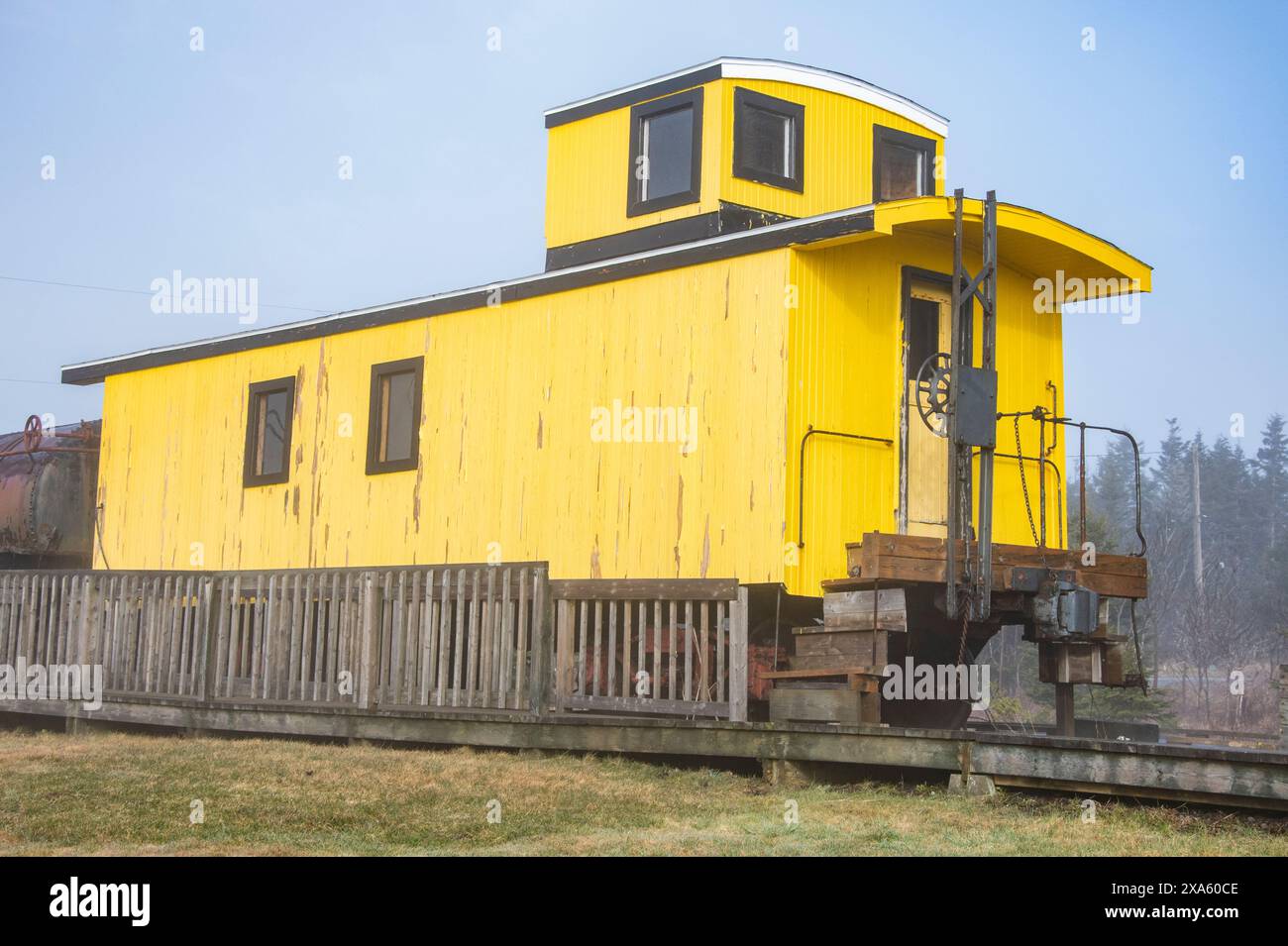 Yellow caboose at S&L Railway Museum in Louisbourg, Nova Scotia, Canada ...