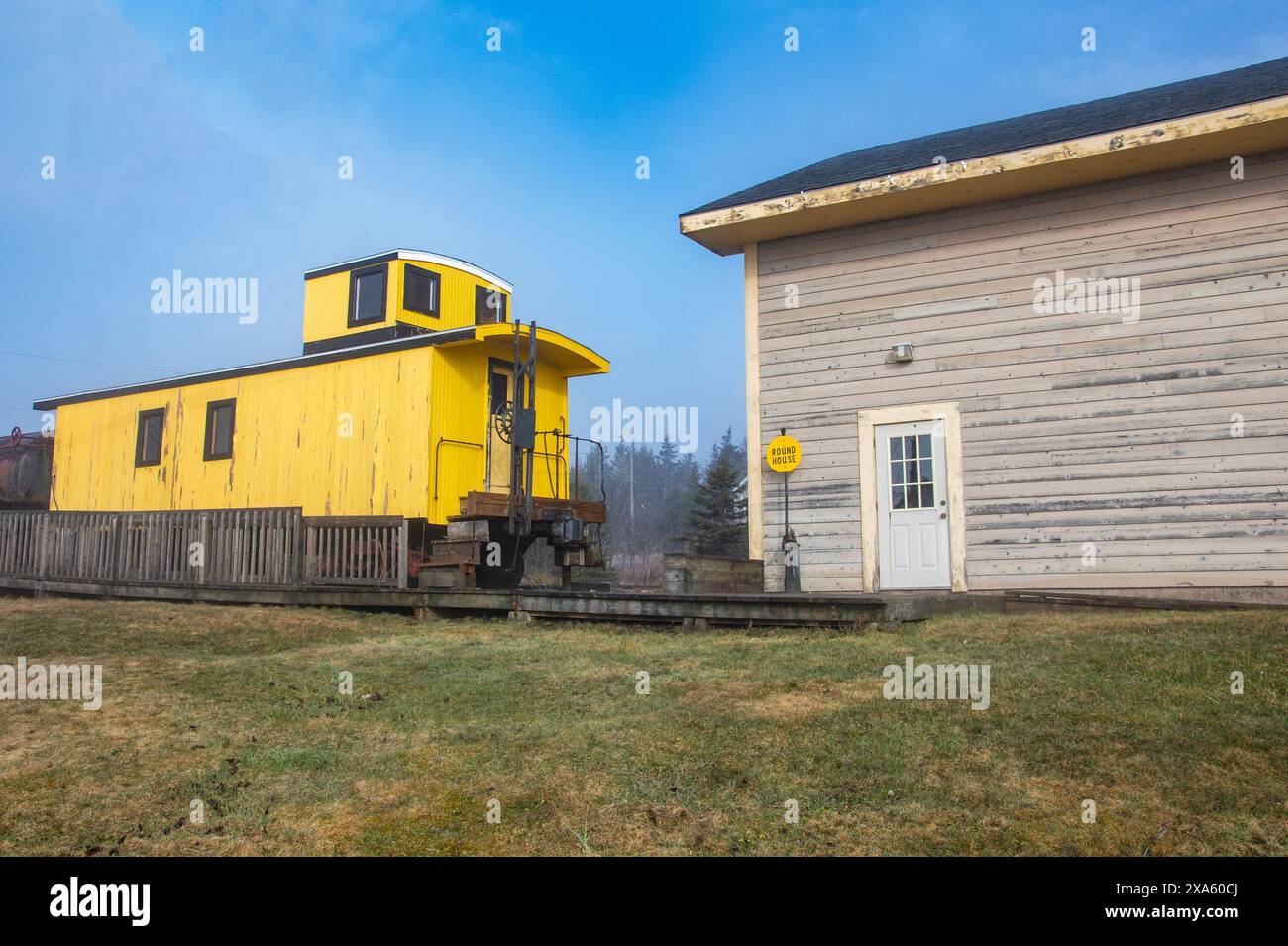 Yellow caboose at S&L Railway Museum in Louisbourg, Nova Scotia, Canada ...