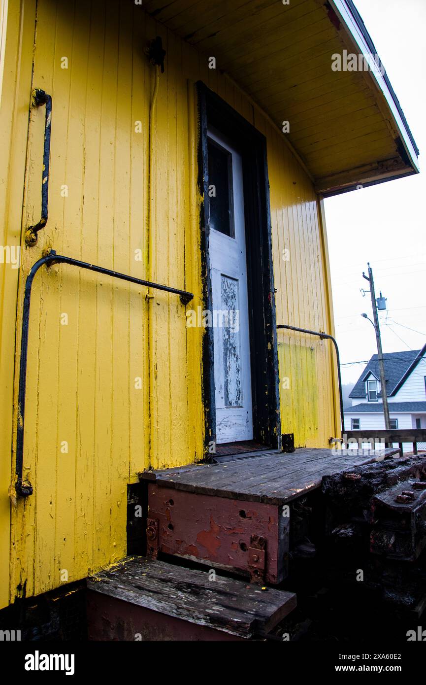Yellow caboose at S&L Railway Museum in Louisbourg, Nova Scotia, Canada ...