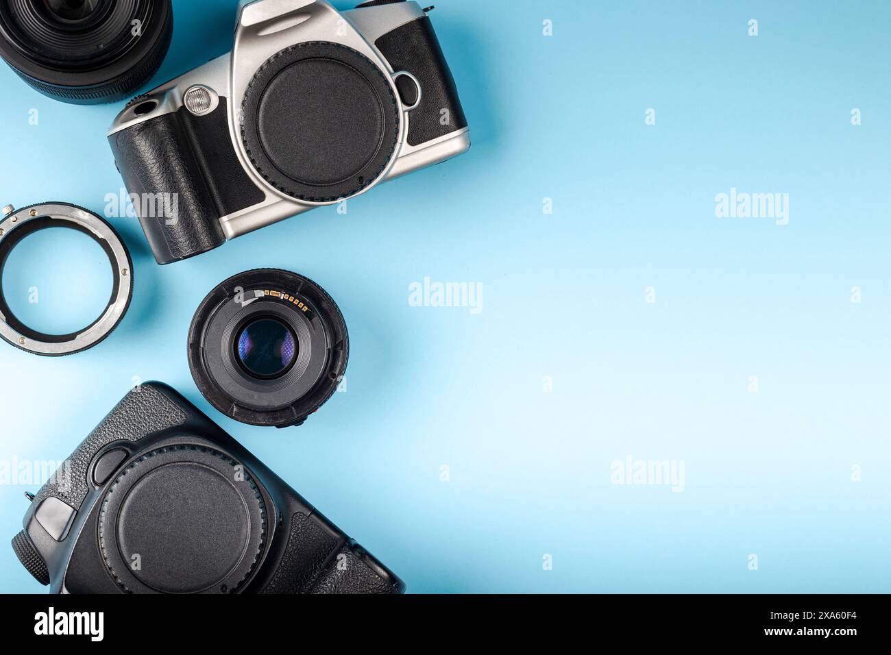 The assorted cameras on a blue backdrop seen from above Stock Photo - Alamy