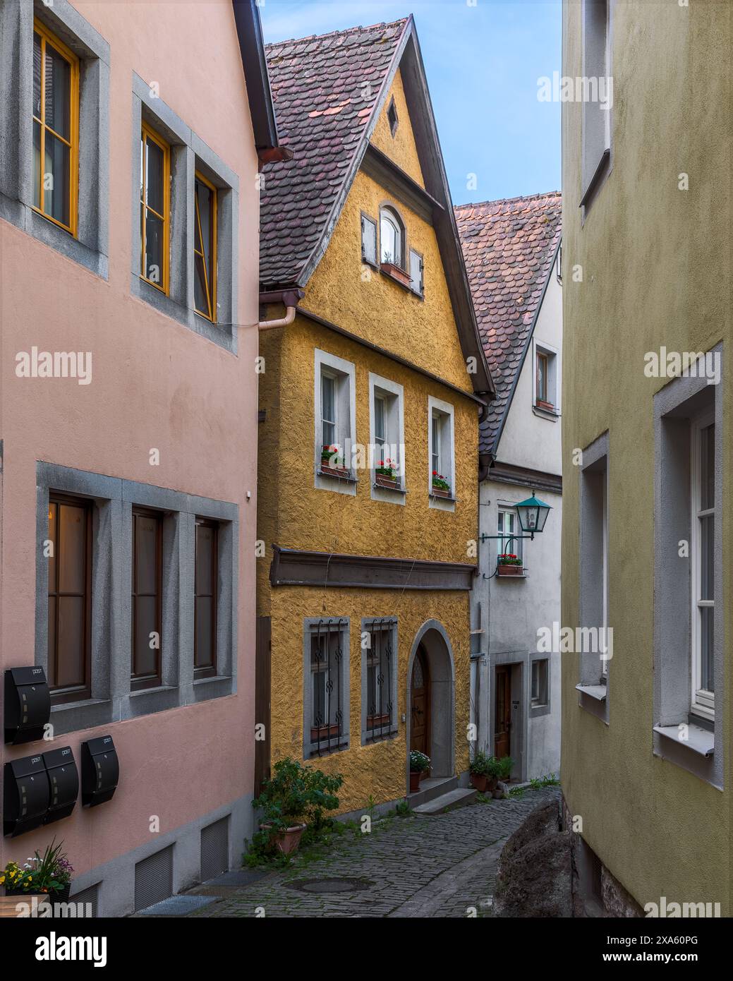 Charming cobbleston alley with old colorful buildings in Rothenburg ob ...