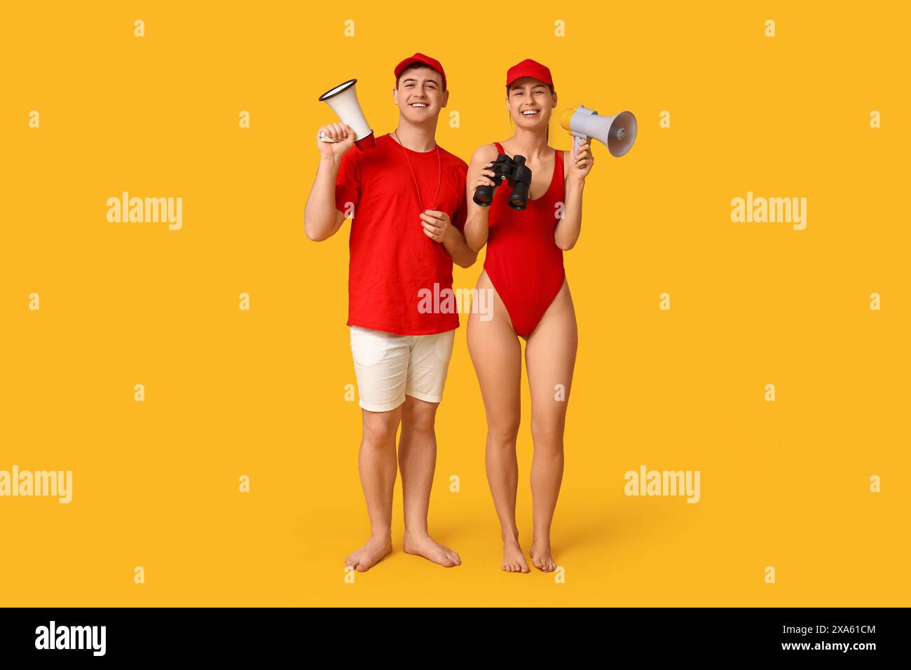 Lifeguards with binoculars and megaphones on yellow background Stock ...
