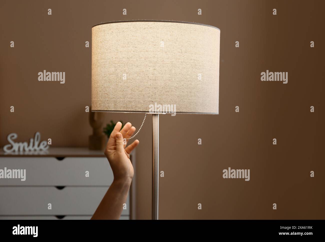 Woman turning off floor hi-res stock photography and images - Alamy
