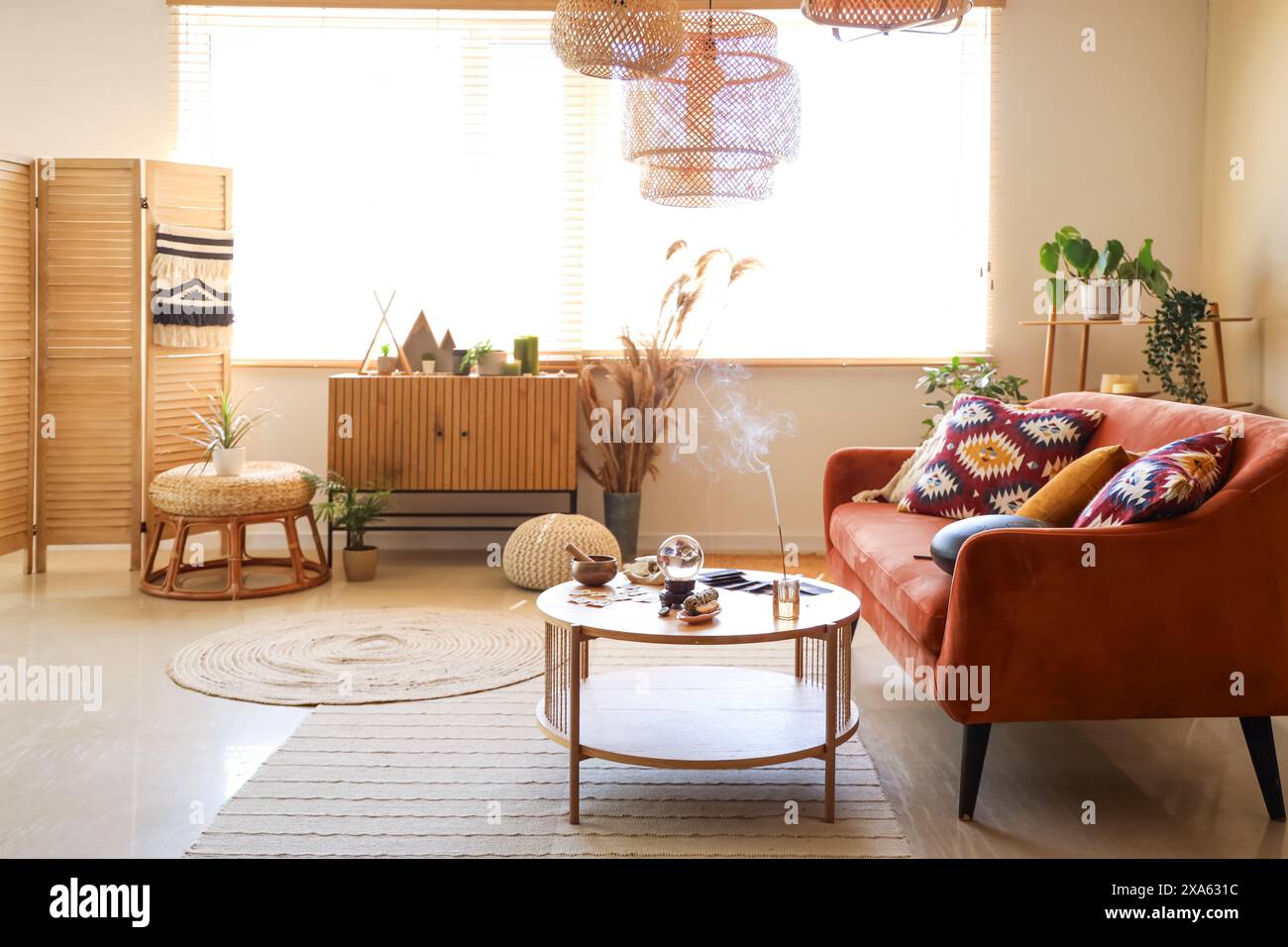 Interior of living room with sofa, plants and witch's magic attributes ...