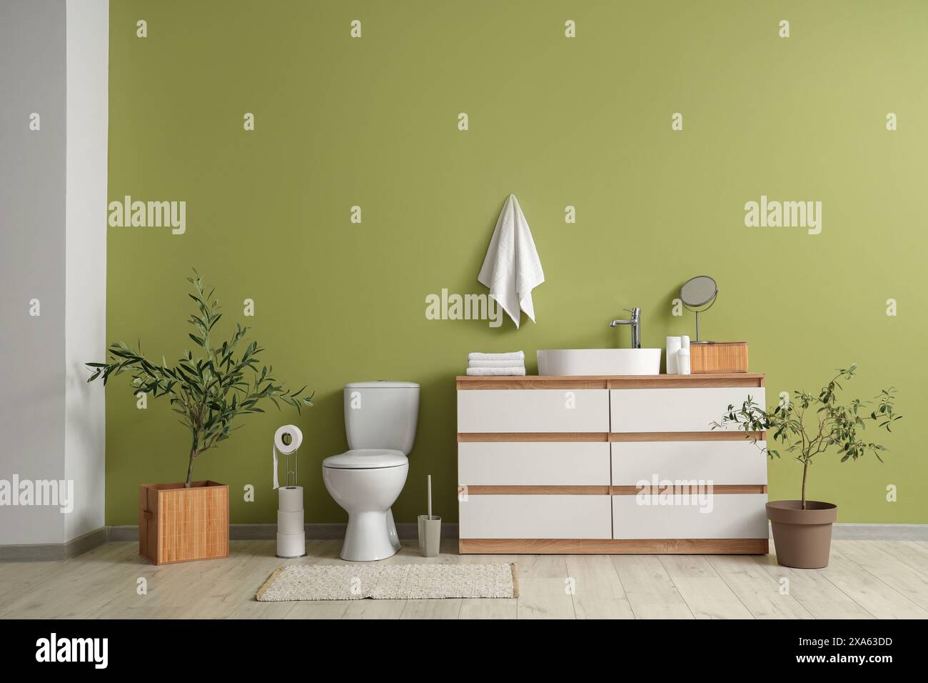 Interior of modern bathroom with big commode, toilet bowl and ...