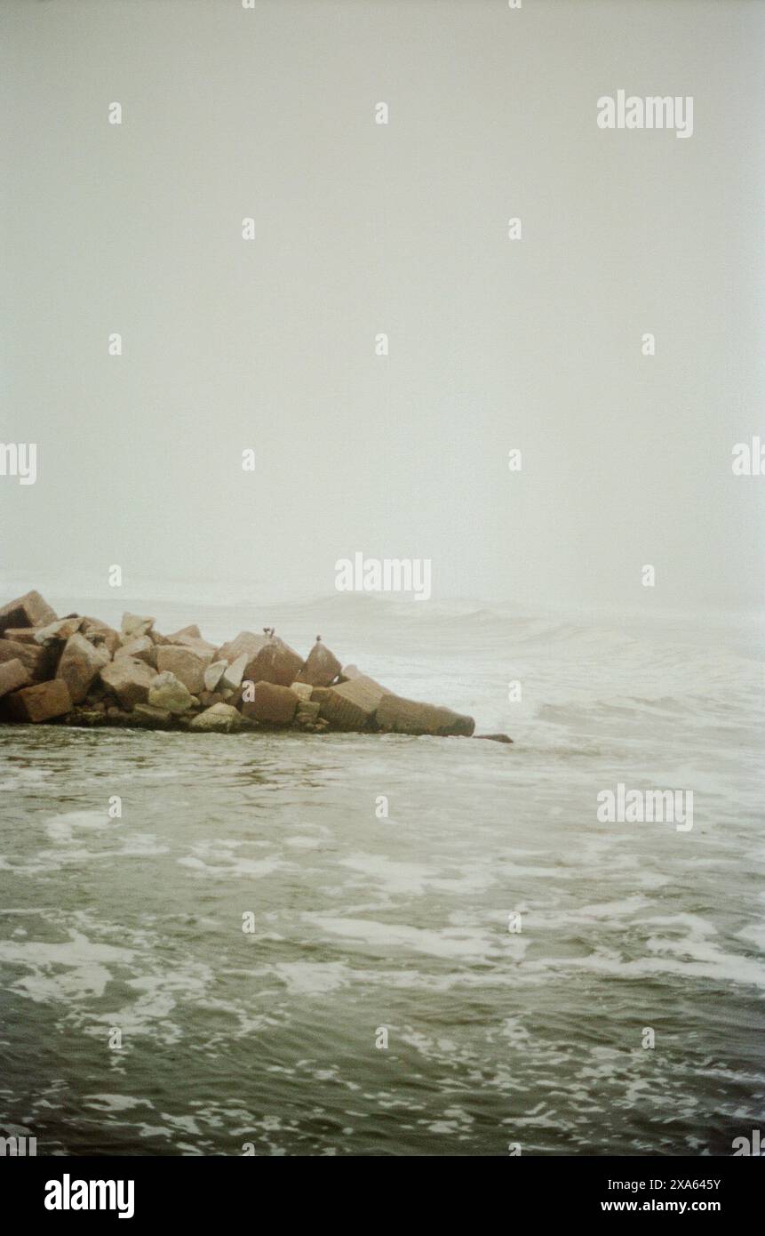A big wave crashes on the beach shore Stock Photo - Alamy