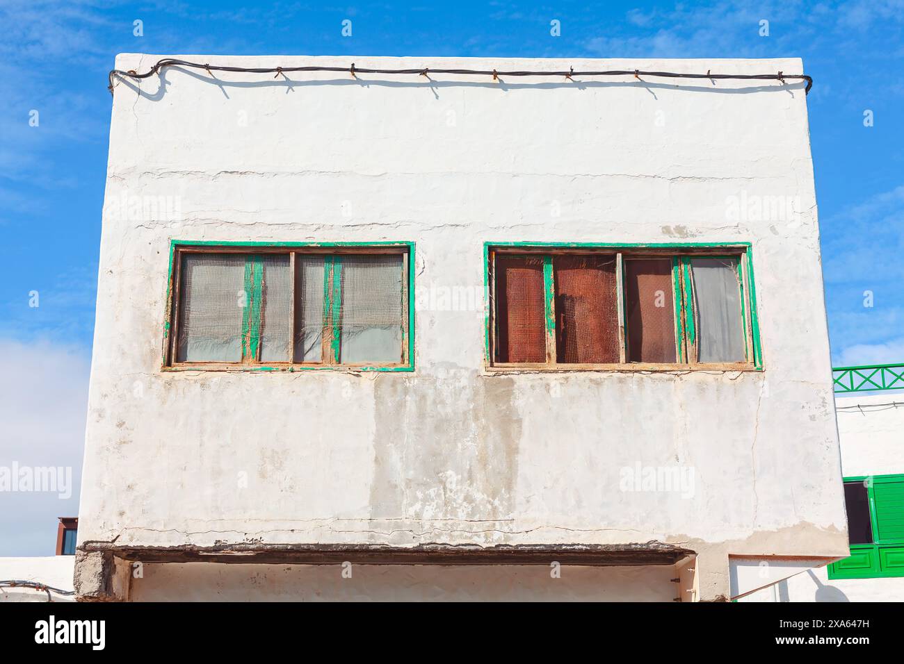 Side view of building with green windows. Typical architecture at ...