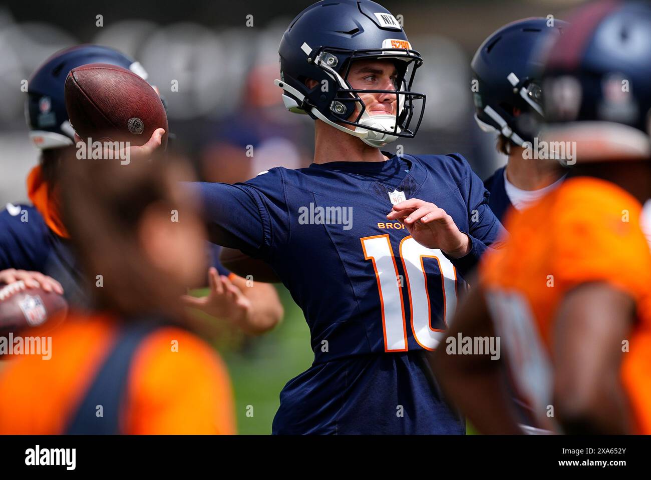 Denver Broncos rookie quarterback Bo Nix takes part in drills during ...