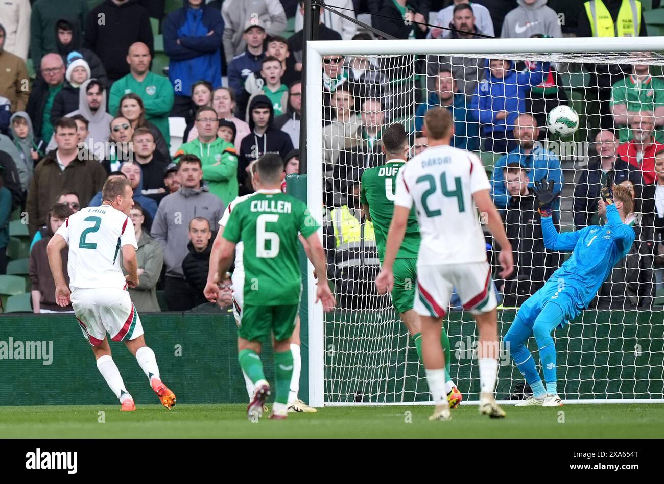 Hungary's Adam Lang (left) scores their side's first goal of the game ...